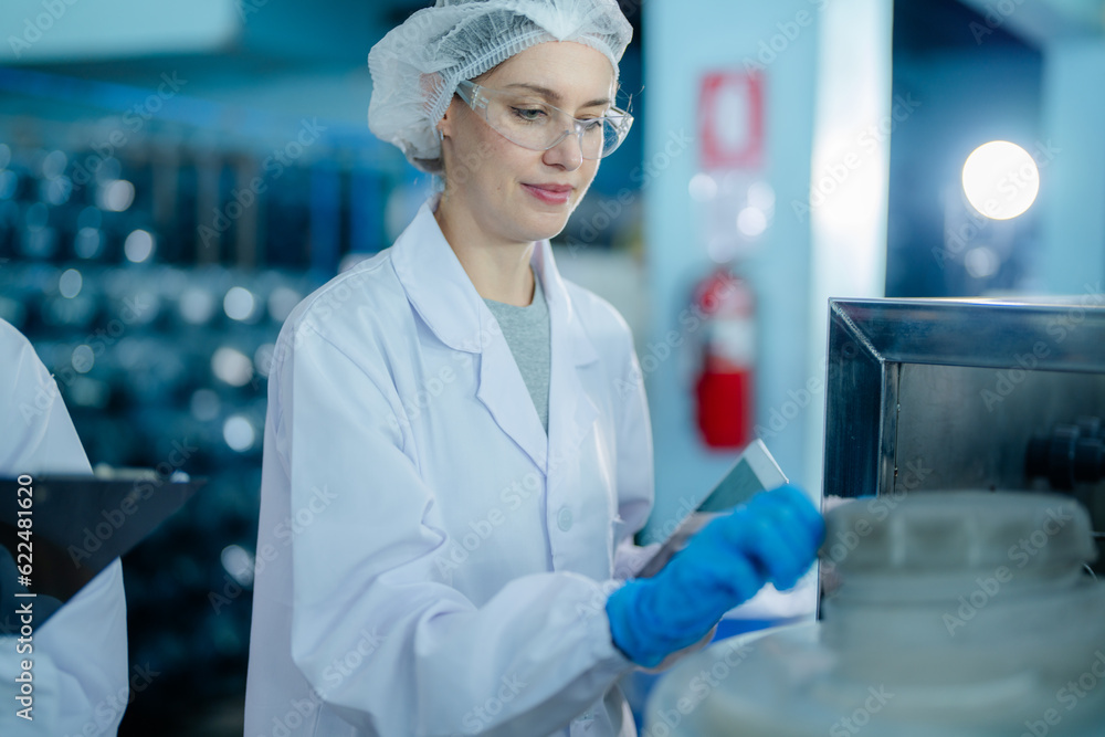 scientist worker checking the quality of the Reverse osmosis machine ...