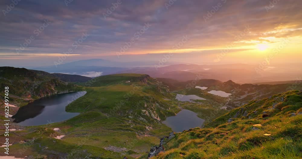 Sunrise above bulgarian mountain peaks, hills, Seven Rila Lakes and ...