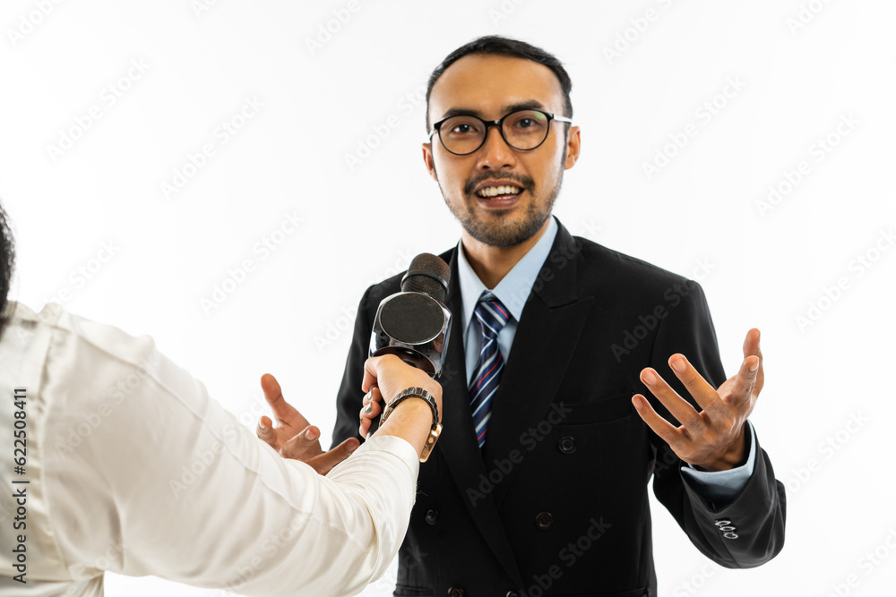 a handsome men with beard and eye glasses talking to the camera when ...