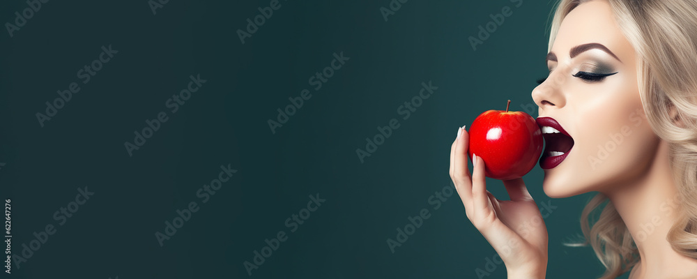 Beautiful young woman holding a red apple - symbolic of sin and ...
