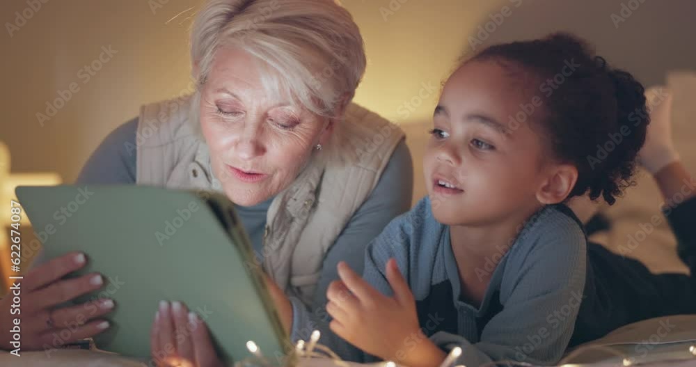 Grandmother, child and tablet on bed, night and together for learning ...