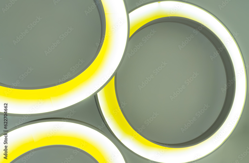 Look up to the round ceiling mounted light fixtures. Yellow circular ...