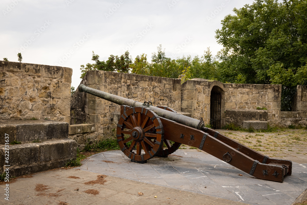 Antique cannon artillery defensive weapon on wall of cultural historic ...