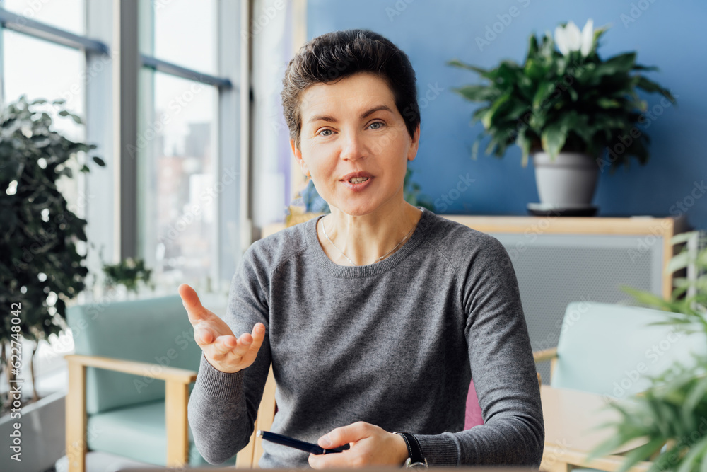 Smiling neutral gender middle aged woman with no make-up in casual ...