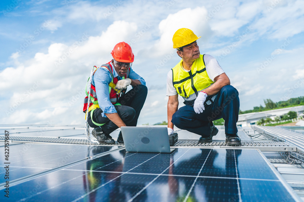 Architectural engineering team working on solar panels and his ...