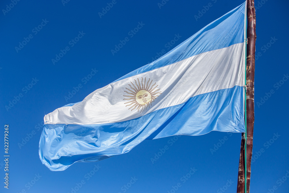 La bandera Argentina flameando en el Cerro Catedral Stock Photo | Adobe ...