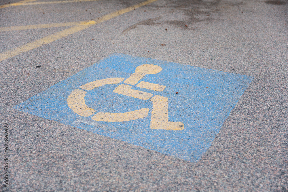 blue wheelchair symbol on a white background. The handicap sign ...