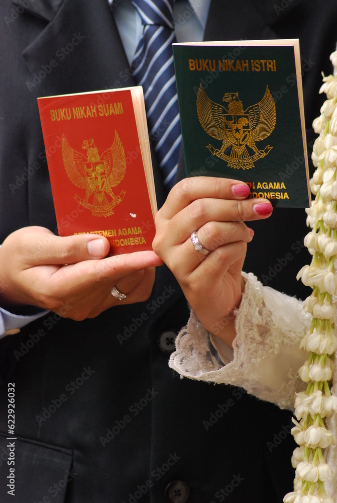 Marriage Couple Hold The Buku Nikah Marriage Book After The