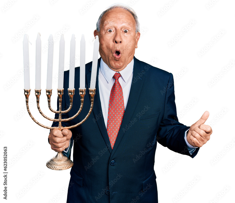Senior business man with grey hair holding menorah hanukkah jewish ...