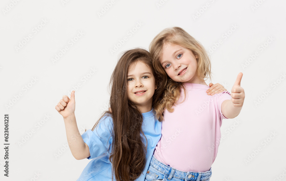 Group portrait of kids girls friends on white studio background. Happy ...