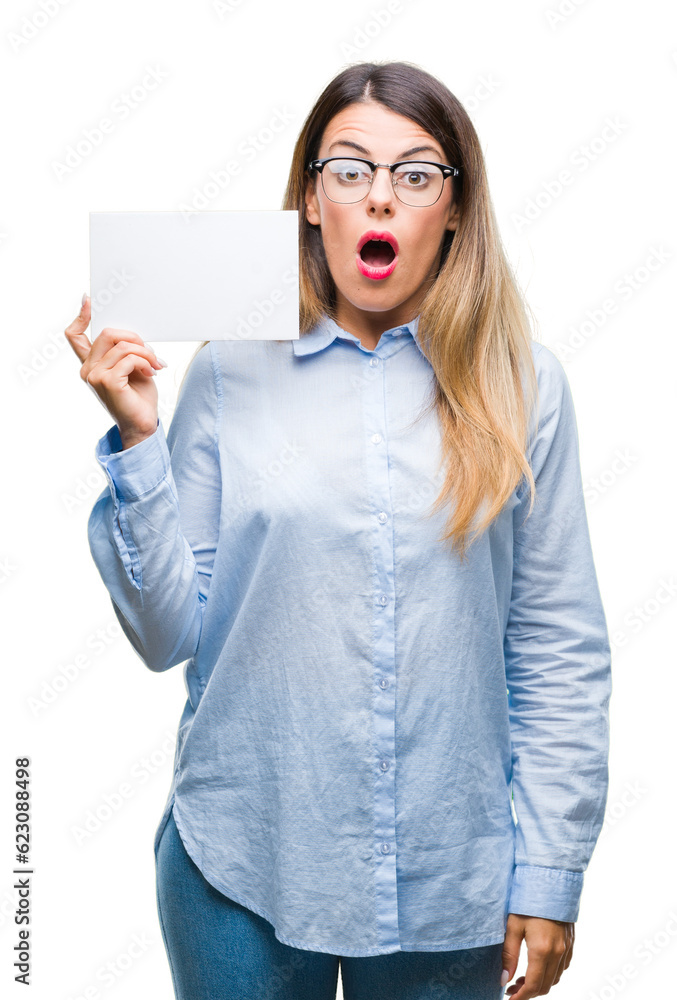 Young beautiful business woman holding blank card over isolated ...
