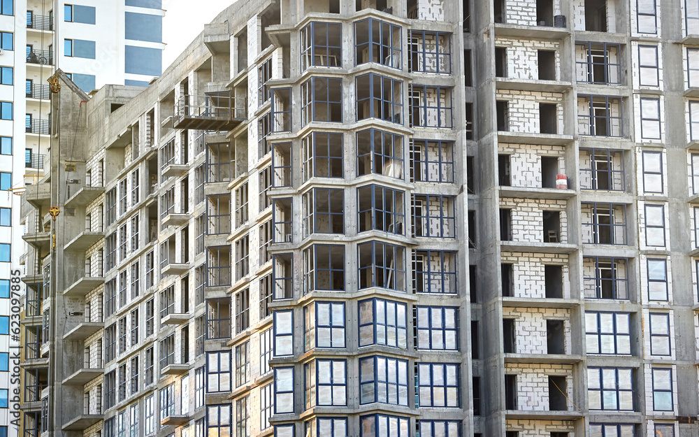 Building under construction, facade glazing. Residential building ...