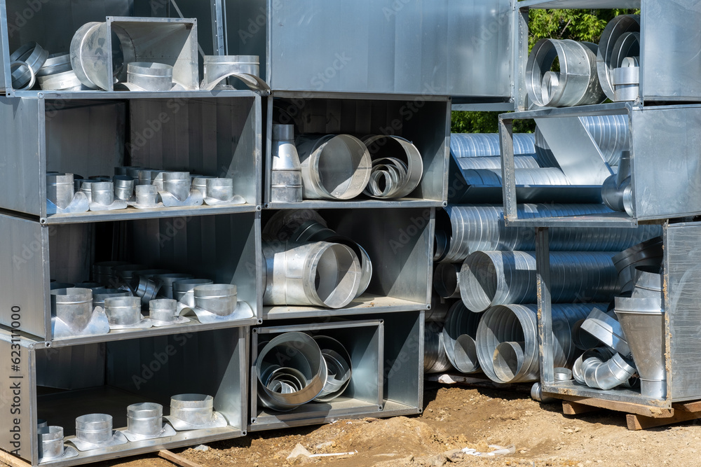 Foto de Various sheet metal air ducts in stock for installation in a ...