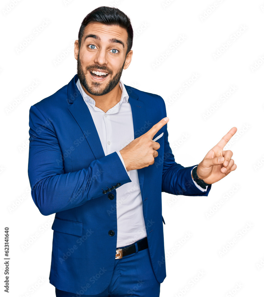 Young hispanic man wearing business jacket smiling and looking at the ...