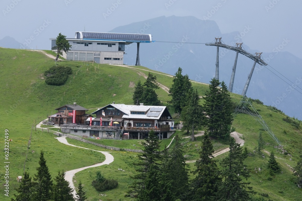 Gosau, Austria - July 7, 2023: Station of cable car on green slope over ...