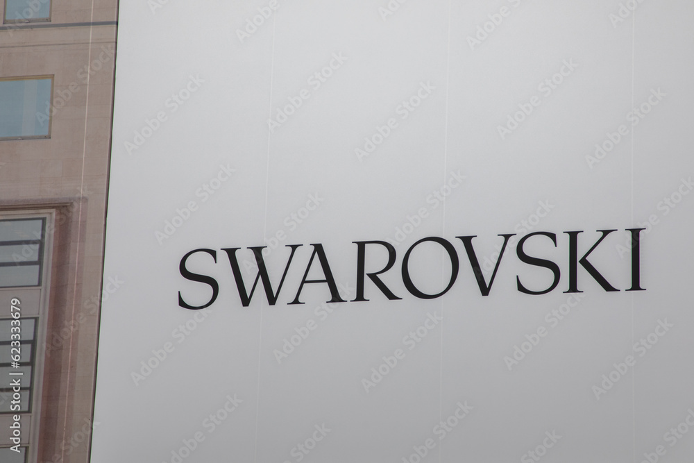 swarovski logo brand and text sign shop on wall facade store chain ...