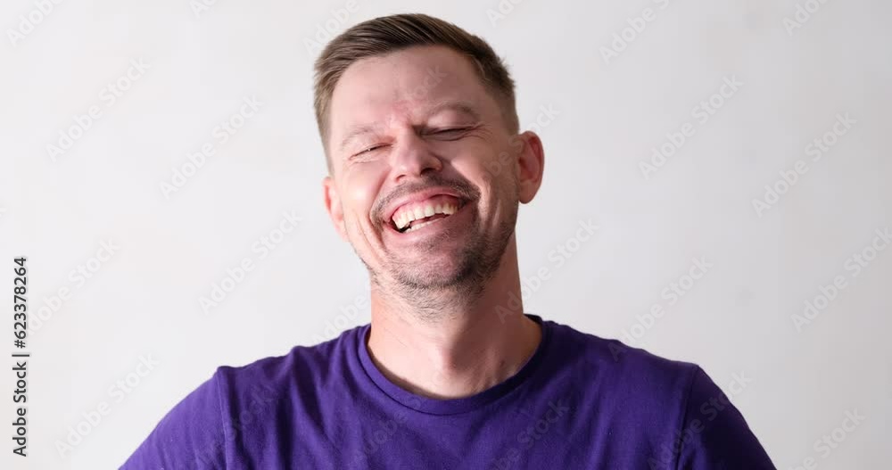 Surprised joyful man laughs close-up. Joyful emotions, facial ...