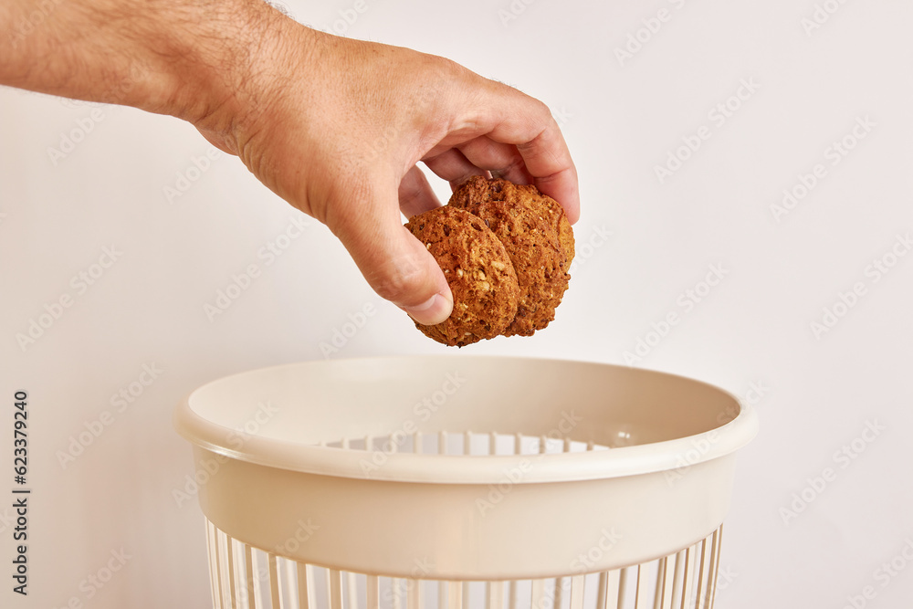 Stale cookies are recycled and thrown in the trash. The concept of ...