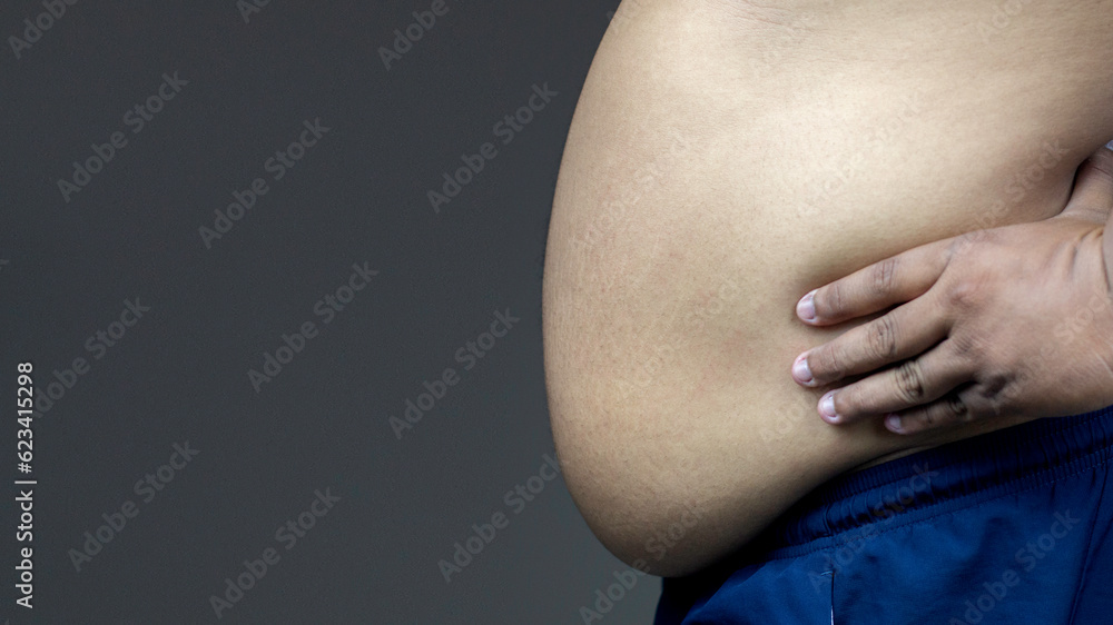 Overweight Asian obese men, He is feeling ill and worried about his ...