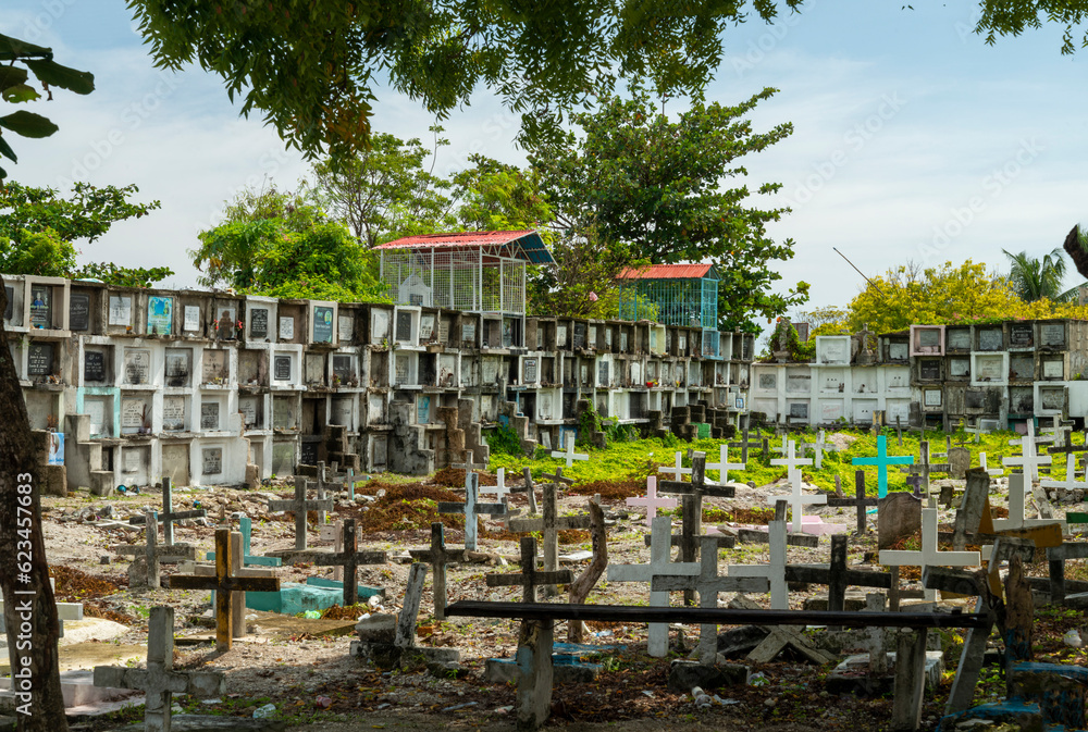 Oslob Public Cemetery,stacked tombs and crowded grave markers,cramped ...