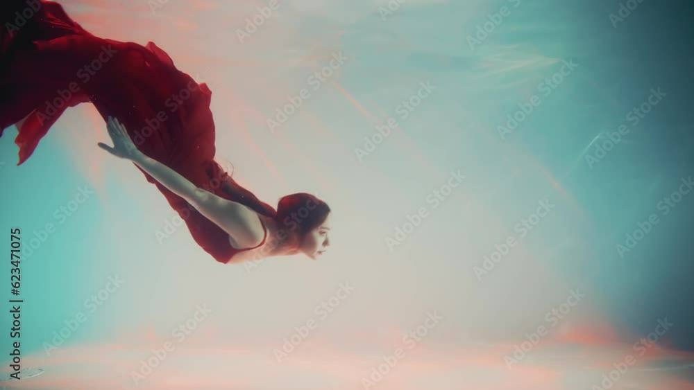 Fantasy woman mermaid swims floating in depth underwater world, long ...