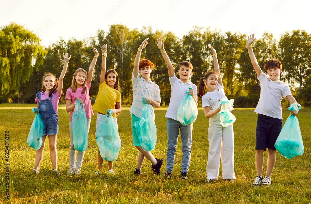 Group of cheerful and active volunteer children gathered together to ...