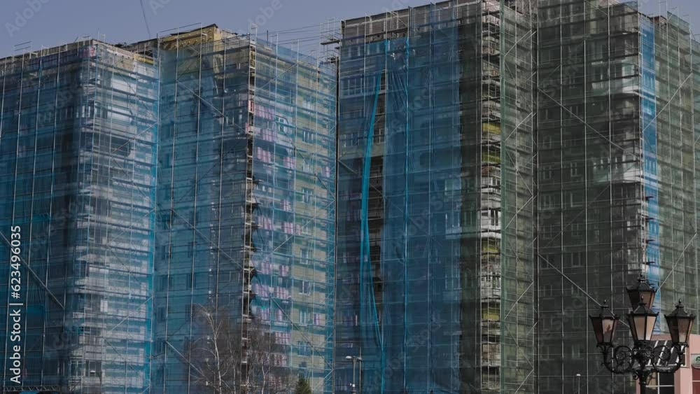 Outdoors shot of apartment houses are undergoing a process of ...