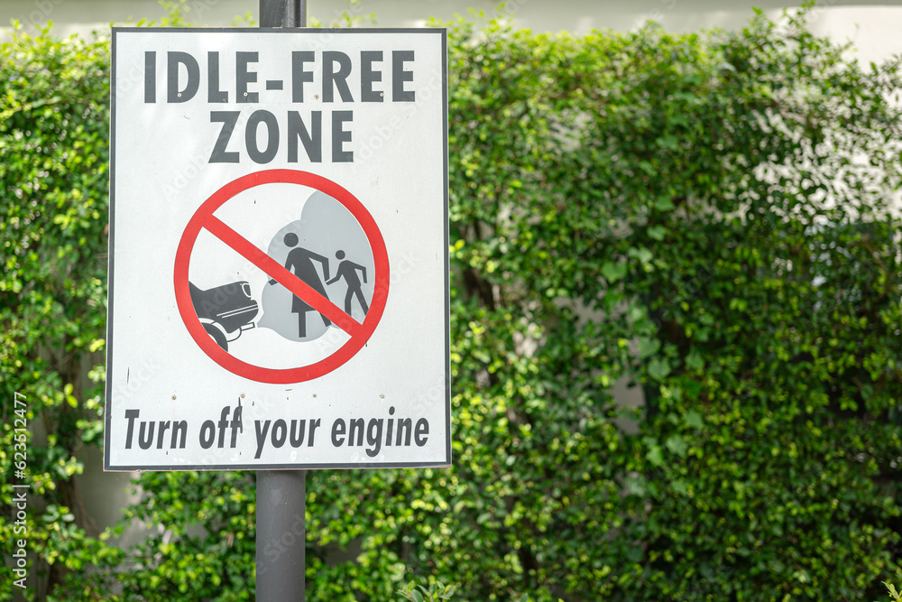 "Idle-Free zone" symbol banner at public vehicle parking lot, the ...