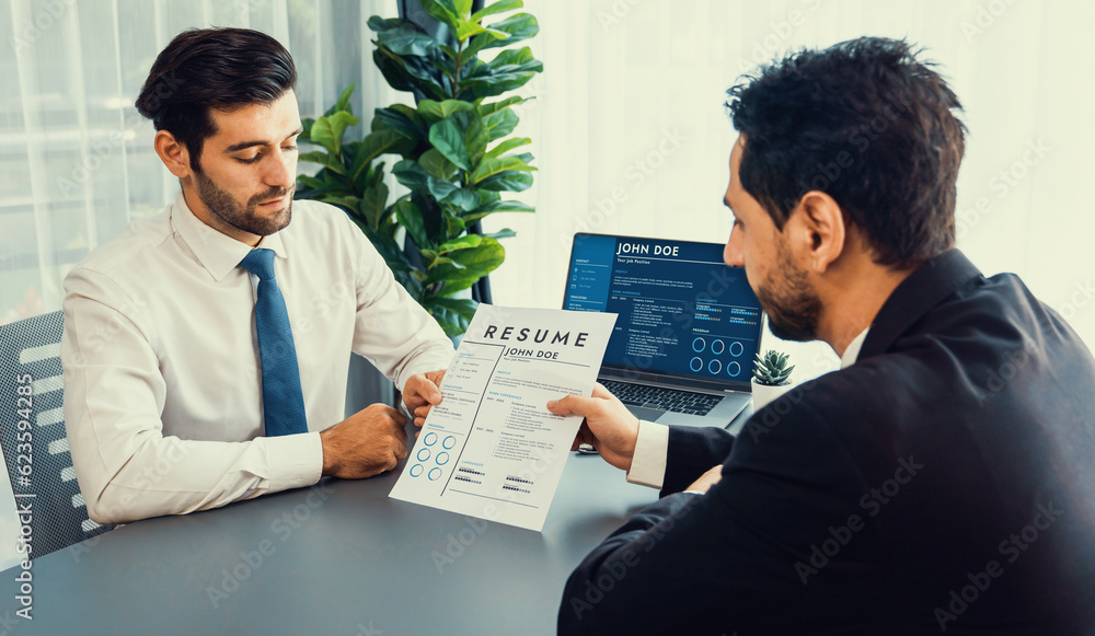 Interviewing job applicant in office with resume paper. Candidate wear ...