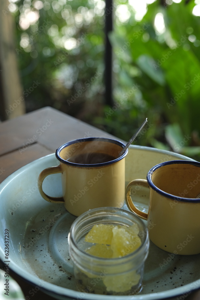 Poci Tea, Teh Poci or tea in enmamel pot oj the table with ature ...