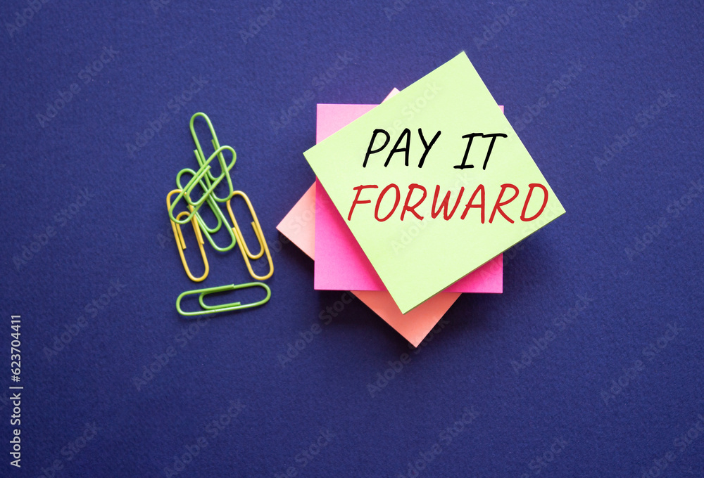 Pay it forward symbol. Concept words Pay it forward on yellow steaky ...