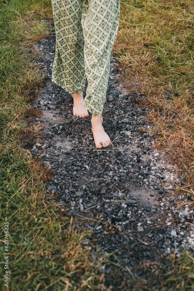 Coal walking or fire walking. Barefoot person on burned wood and hot ...