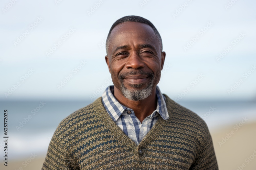 Portrait photography of a satisfied Nigerian black man in his 50s ...