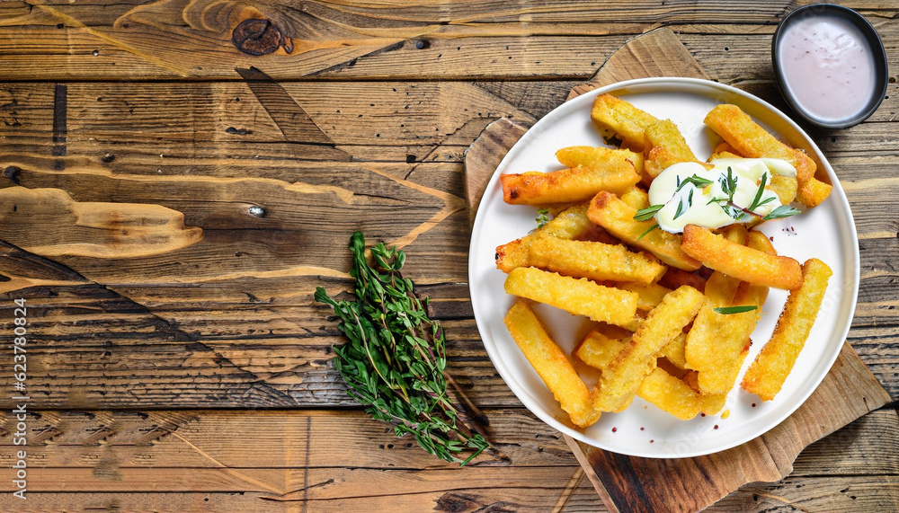 Homemade polenta chips fries with sea salt, parmesan, thyme, rosemary ...