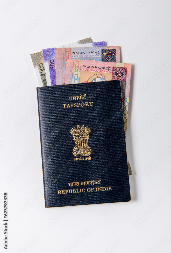 Kuwaiti Dinar currency notes placed in an Indian passport booklet ...