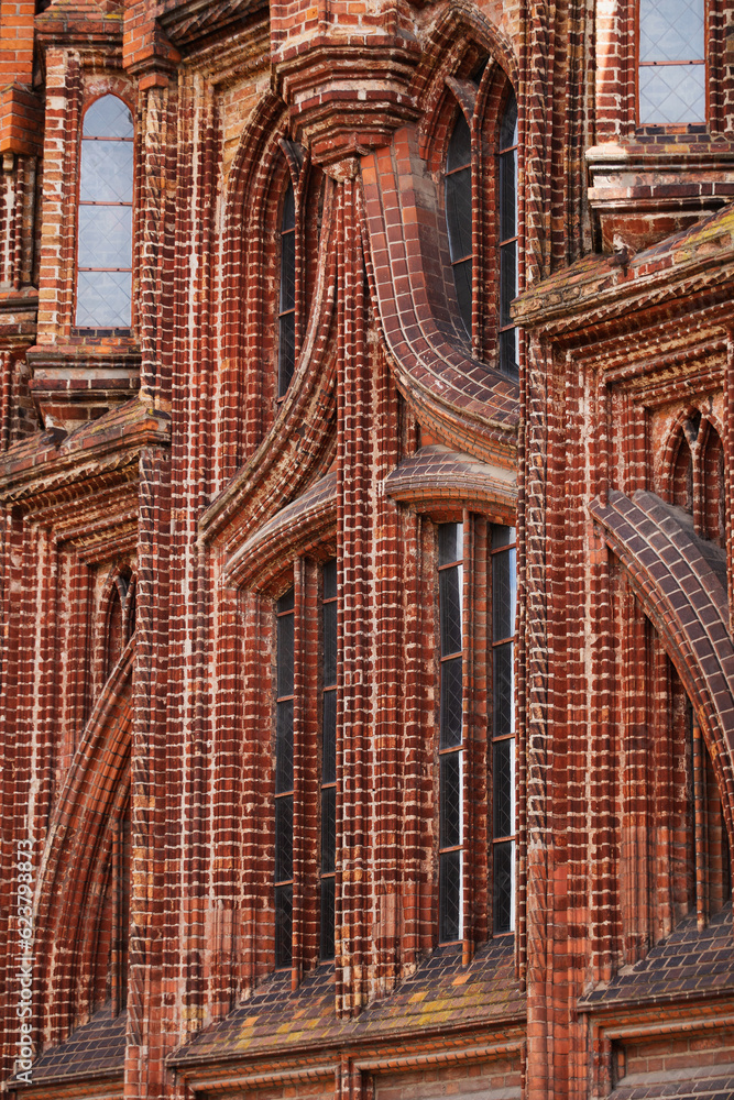 Brick wall with narrow arched window of gothic architecture ...
