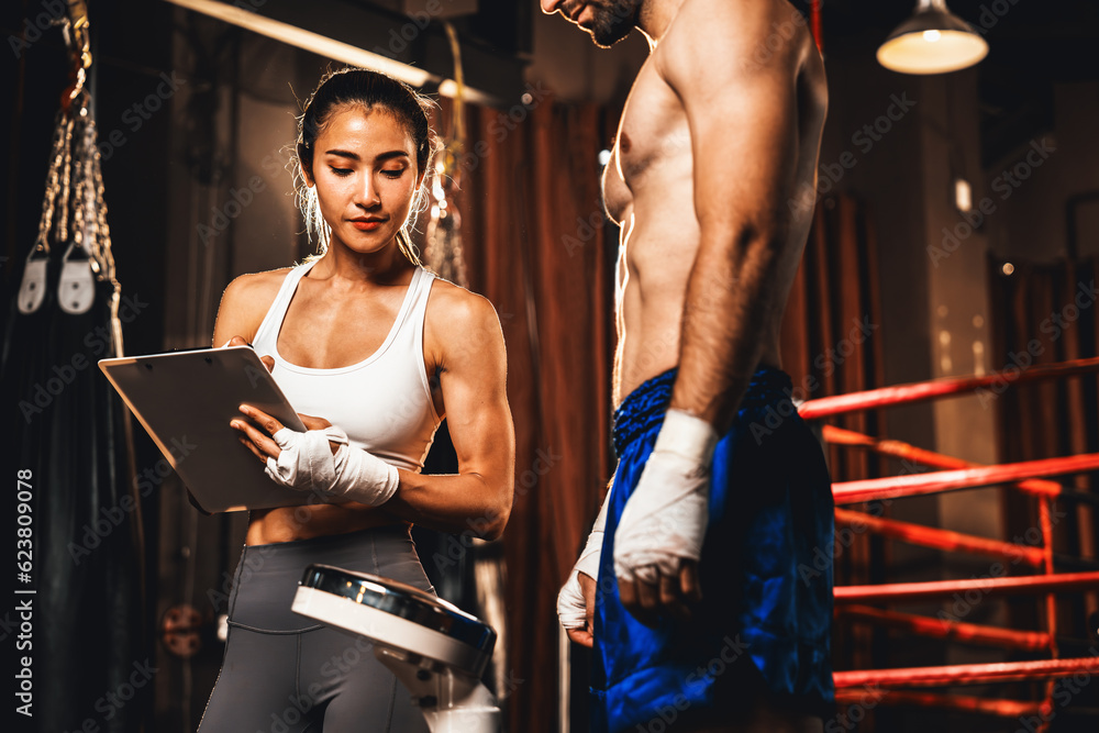 Muay Thai boxer step on weight scale for boxing class designation by ...