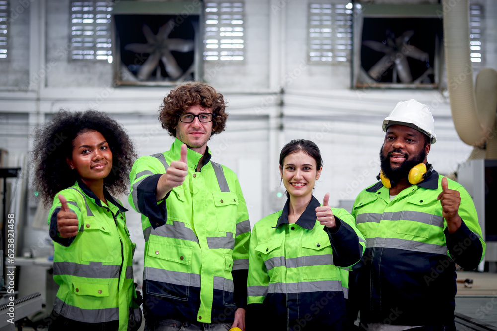 Multi-ethnic group of industrial women men worker team wearing helmet ...