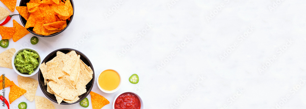 Nachos and dip corner border. Above view on a white marble banner ...