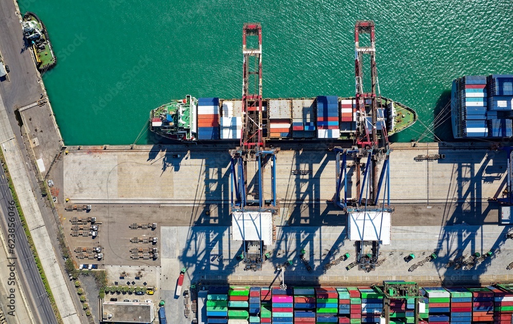 Vertical top down view of cargo containers piled on the quayside and ...