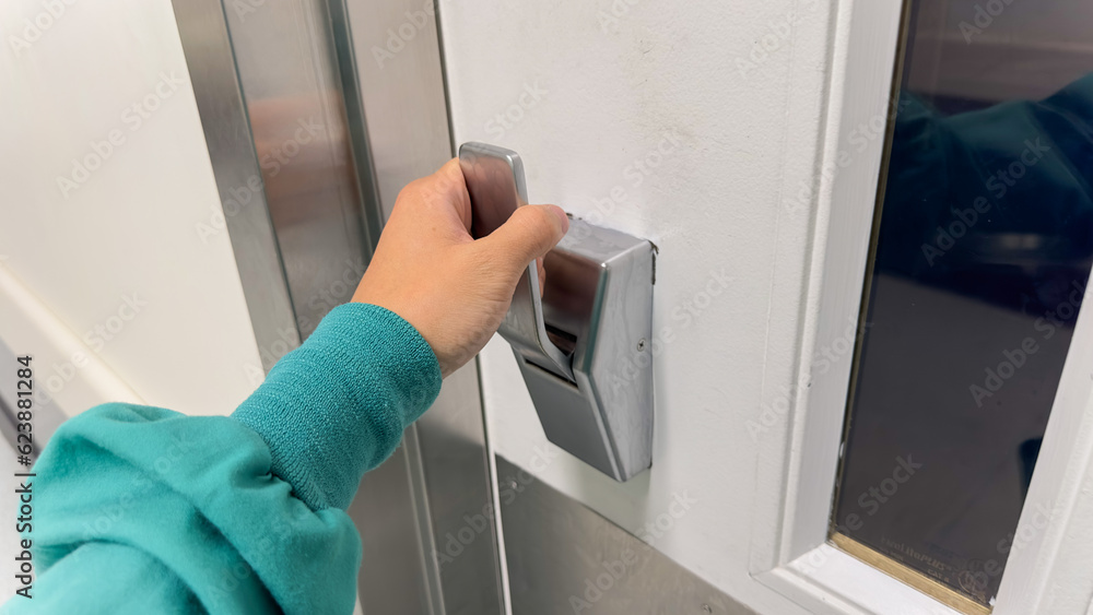 Hands on door handles represent opportunity, choices, and transition ...