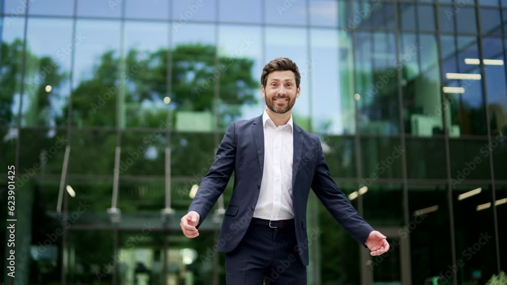 Confident happy business man invites you to join the team near the ...