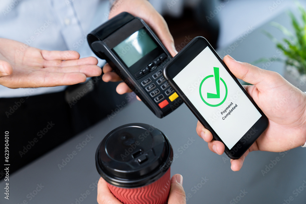 Hand holding smartphone with NFC QR code device, scanning contactless ...