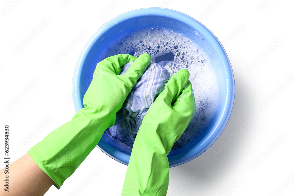 Woman in green rubber gloves washing clothes in plastic basin isolated ...