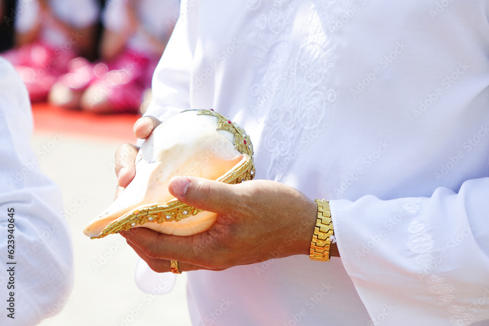 Man holding on traditional conch horn in hinduism ceremony Stock Photo ...