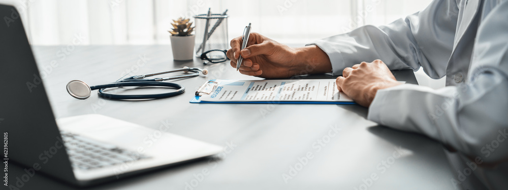 Doctor carefully review detailed medical report with laptop and ...