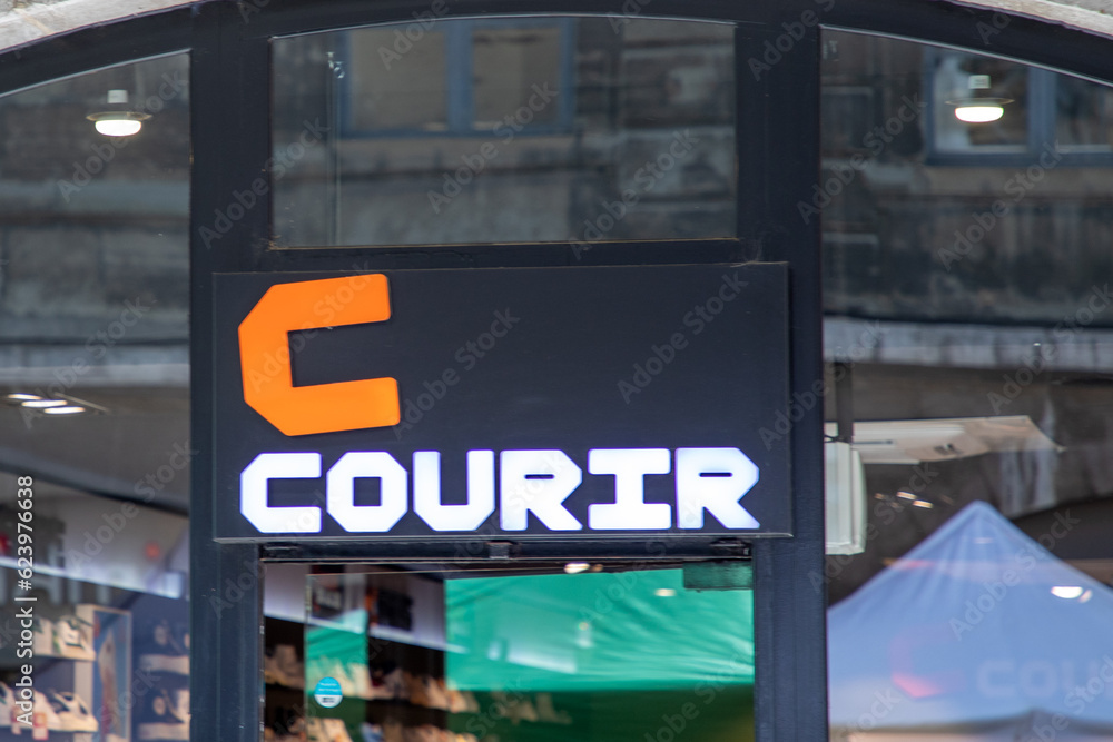 courir c logo storefront and brand text sign front wall shop facade ...