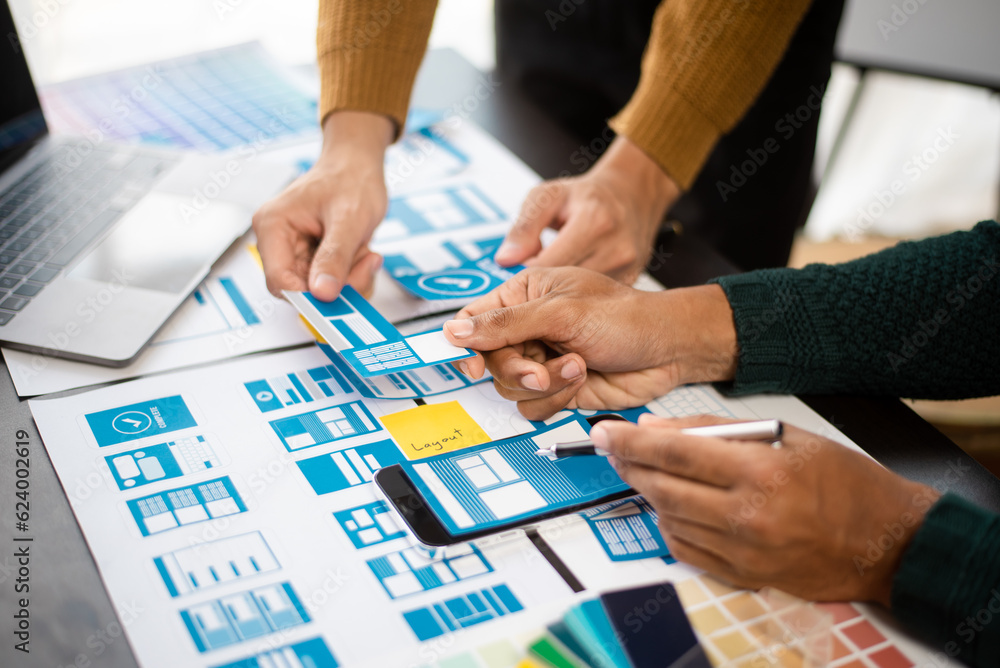 UI designer and UX developer team designer brainstorming about mobile ...