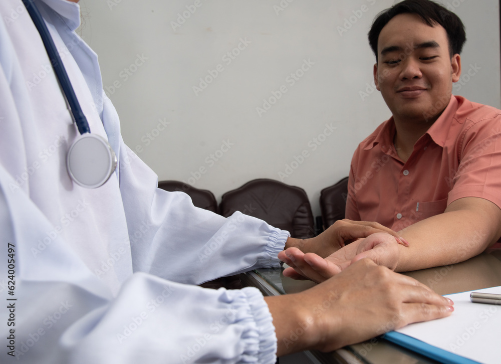 Medicine doctor do physical exam patient's wrist pulse in examination ...