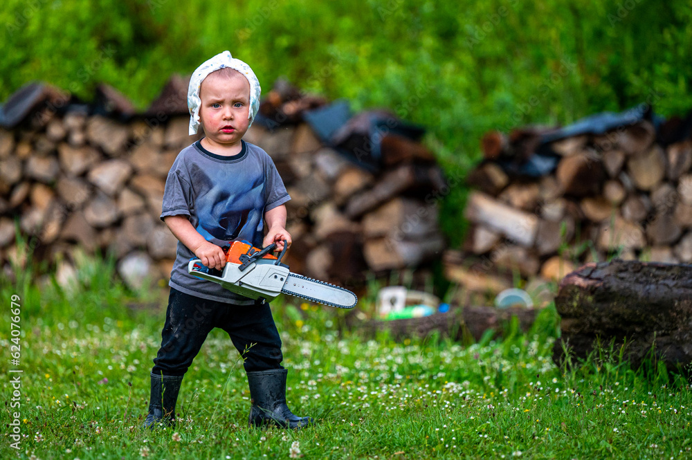 Funny picture of a young boy with a diaper on his head holding a toy ...